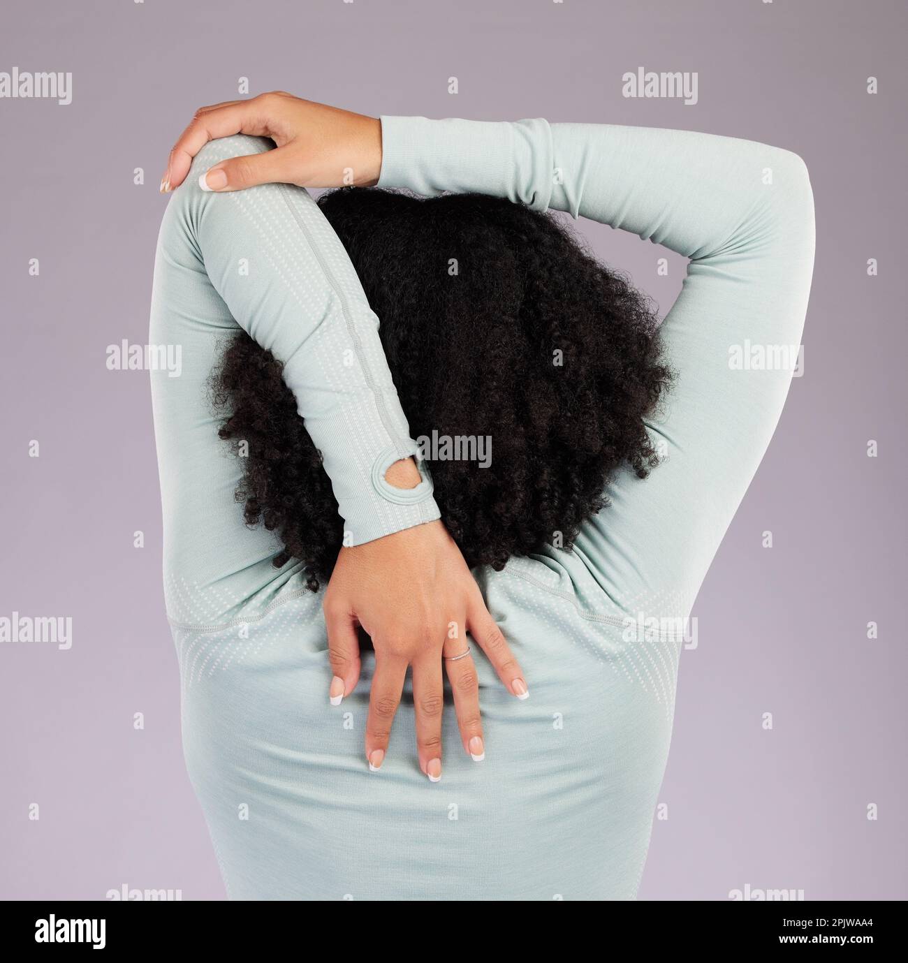 Stretching, arms and back of a woman for fitness isolated on a studio background. Training ...