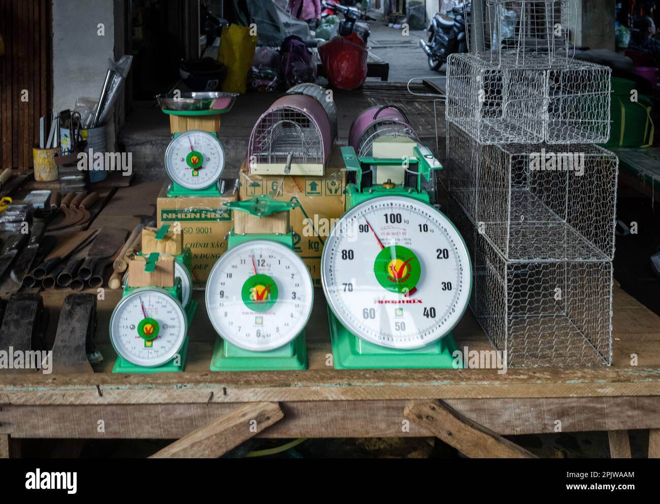 Weighing scales, rat cages, axe heads, knives and scythes for sale on a ...