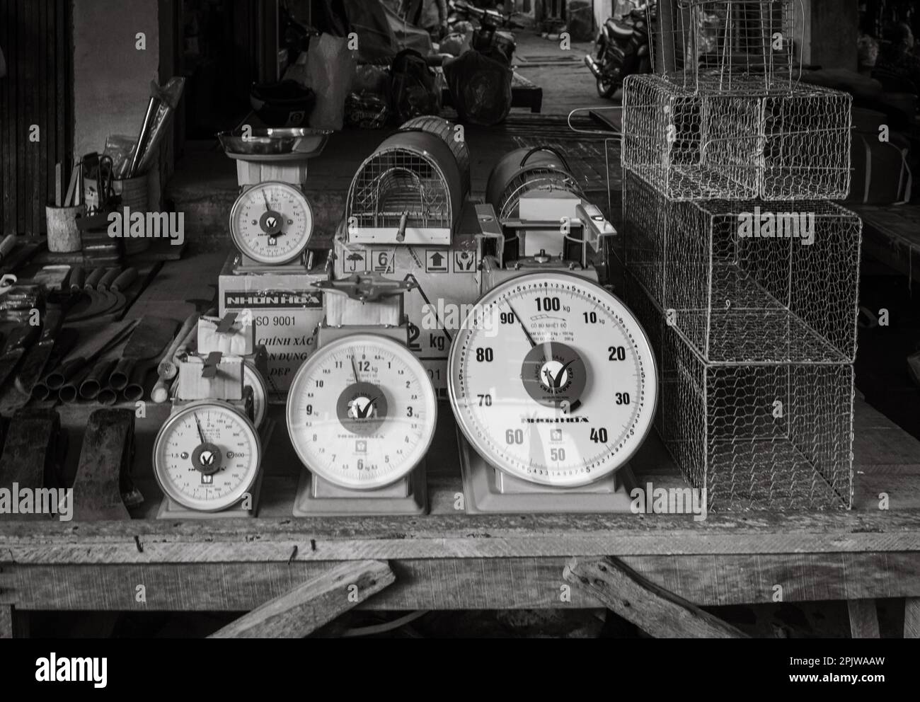 Weighing scales, rat cages, axe heads, knives and scythes for sale on a ...