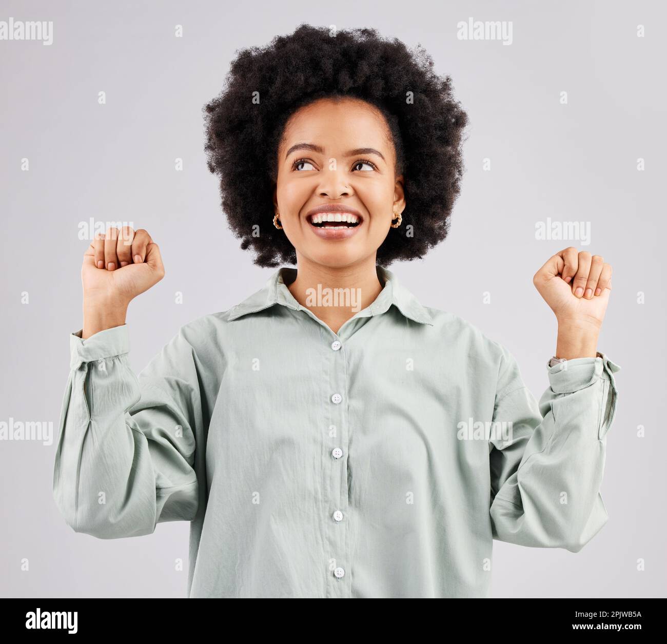 Excited, cheer and face of black woman in studio with winning ...