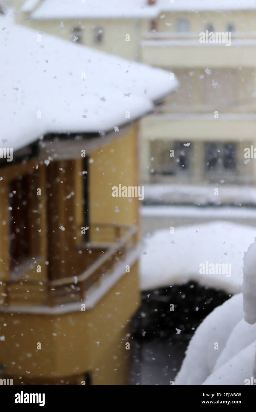 There is heavy snow outside the window. Blurred abstraction Stock Photo ...