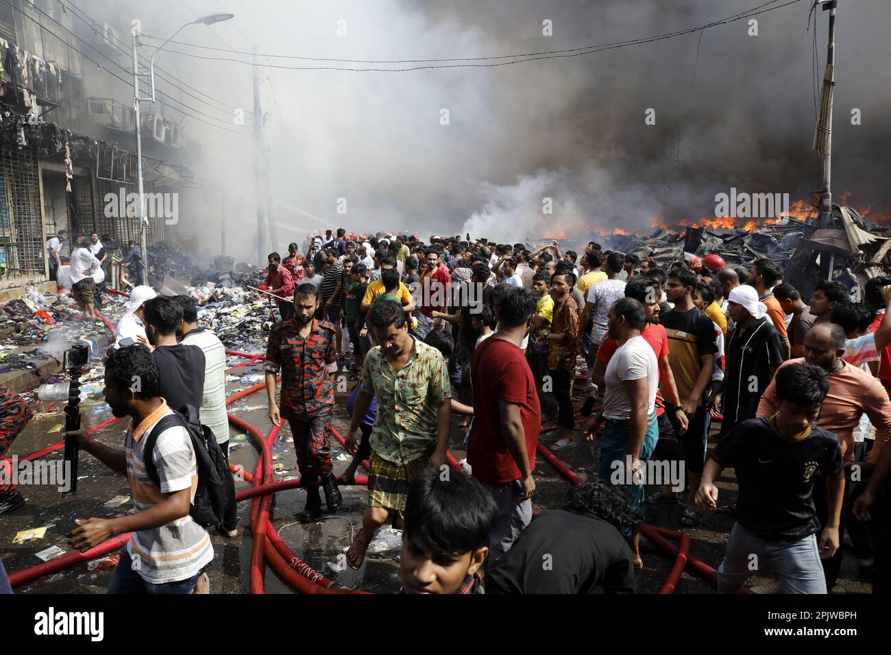 Dhaka, Bangladesh, 04/04/2023, Smoke fills the air during a fire at the ...