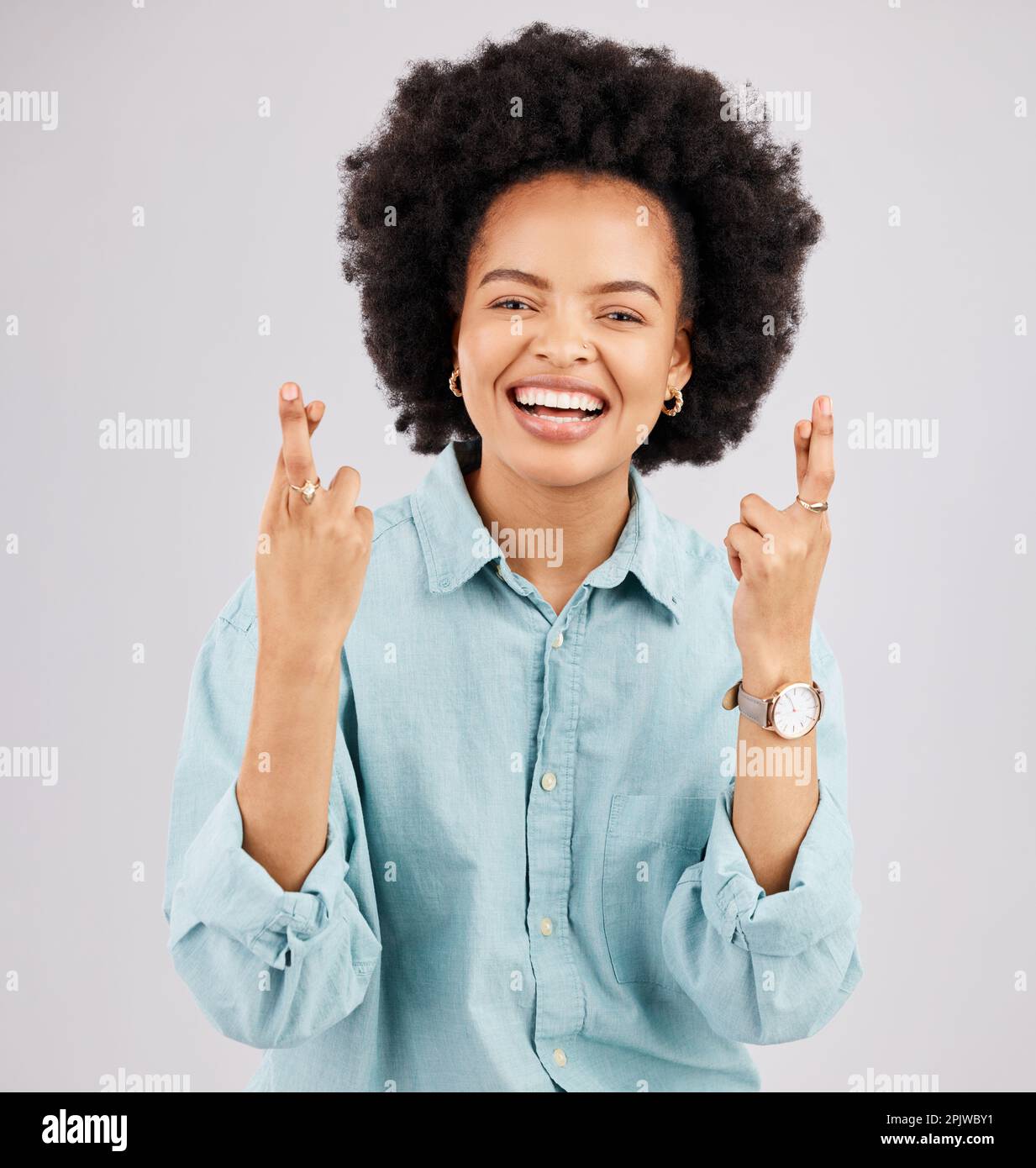 Luck, woman portrait and fingers crossed with hope and smile in a ...