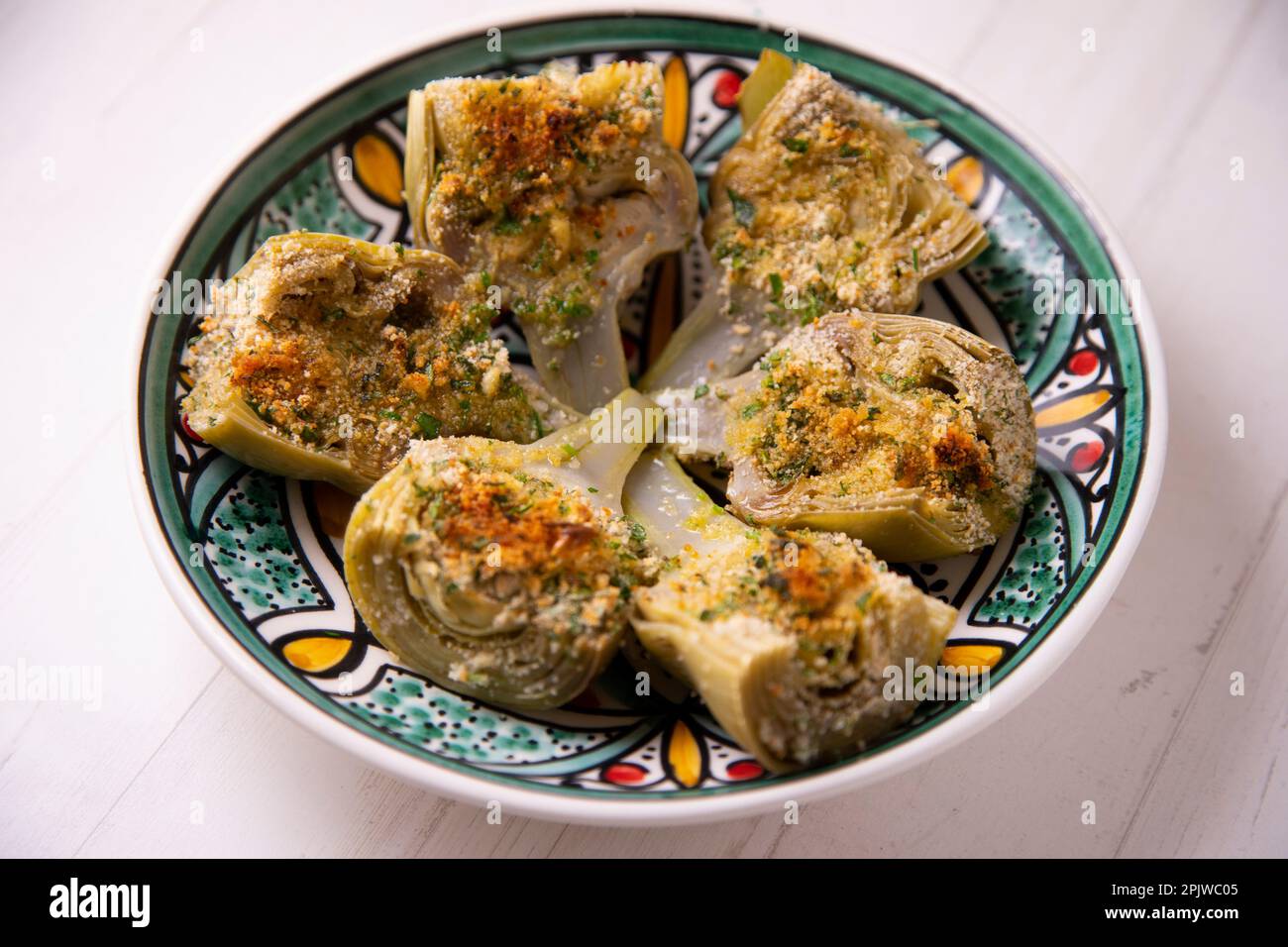 Baked artichokes with salt. Traditional Spanish recipe Stock Photo - Alamy