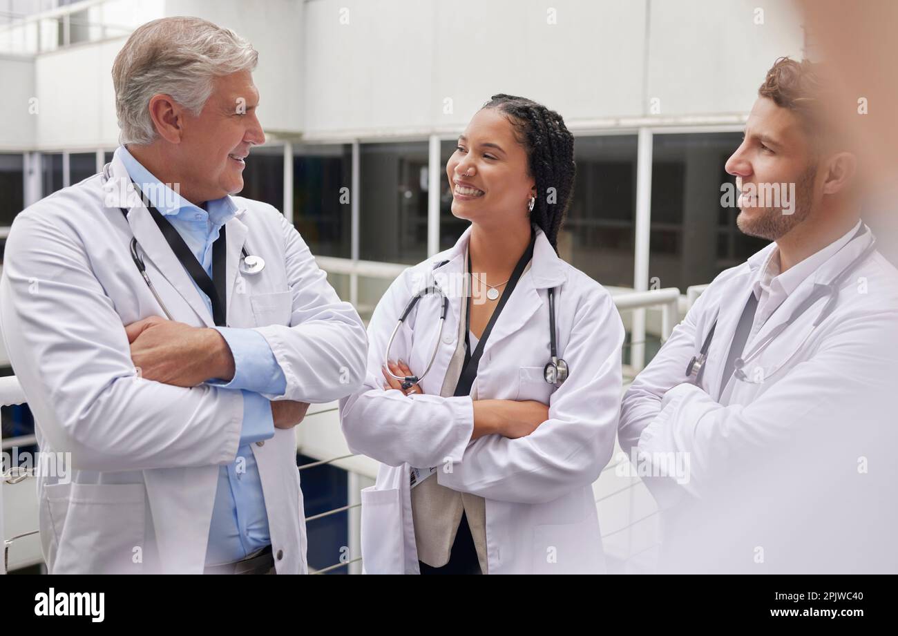Discussion, healthcare and team of doctors in the hospital talking in hallway after consultation ...
