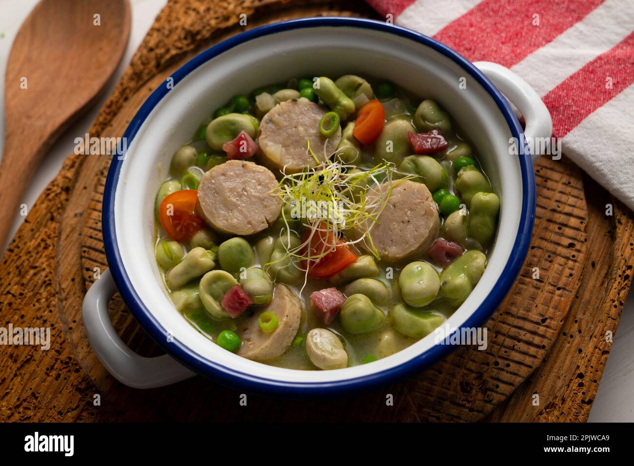 Bean stew with ham and black pudding. Traditional Spanish tapa recipe ...