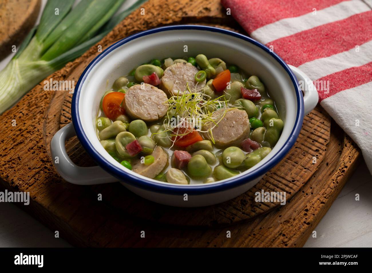 Bean stew with ham and black pudding. Traditional Spanish tapa recipe ...