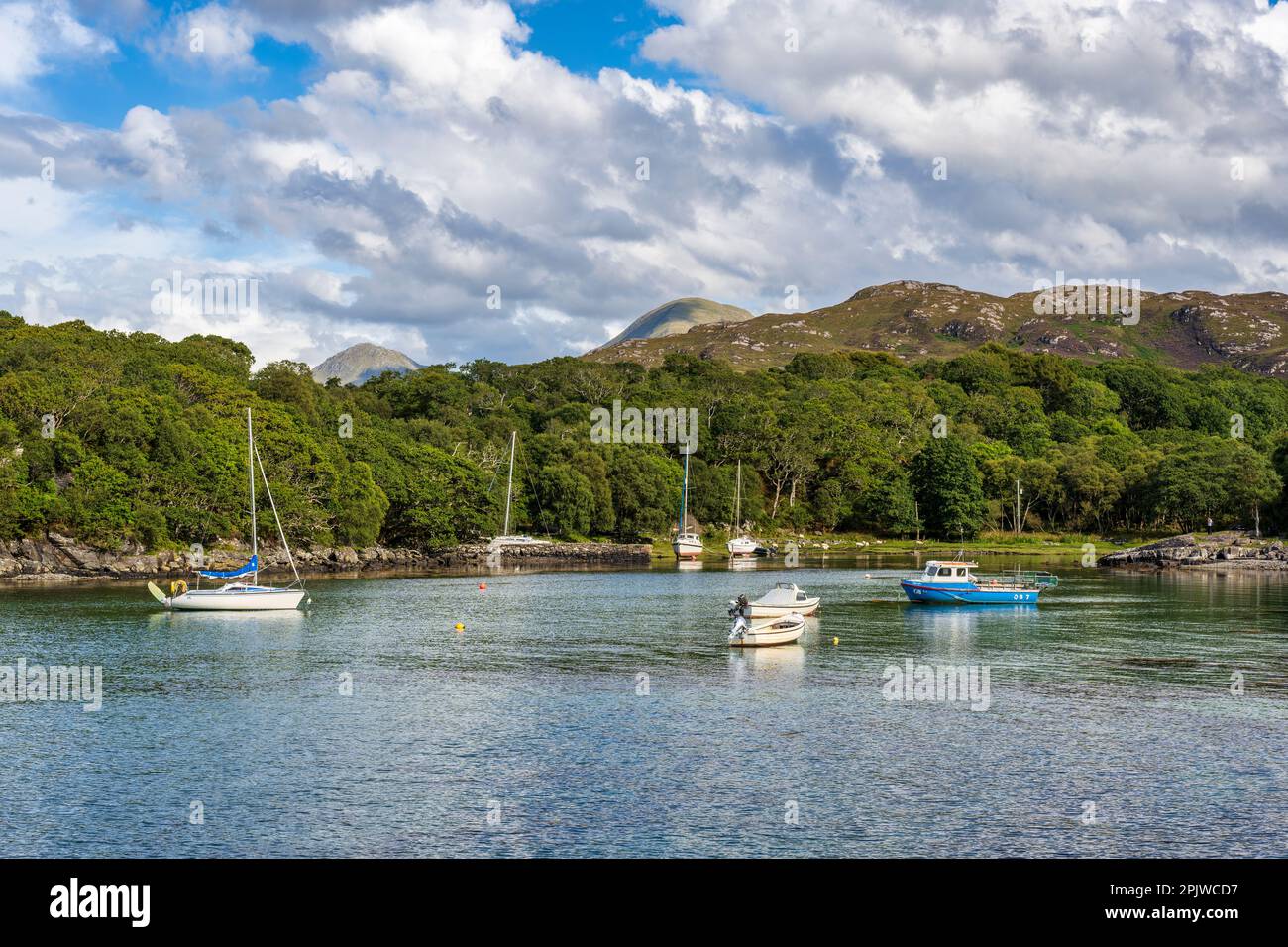 Boats moored in sheltered harbour in Samalaman Bay at Glenuig on the ...