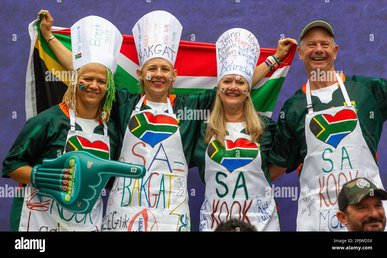 Spectators wave a South Africa flag and cheer as they watch the Hong ...