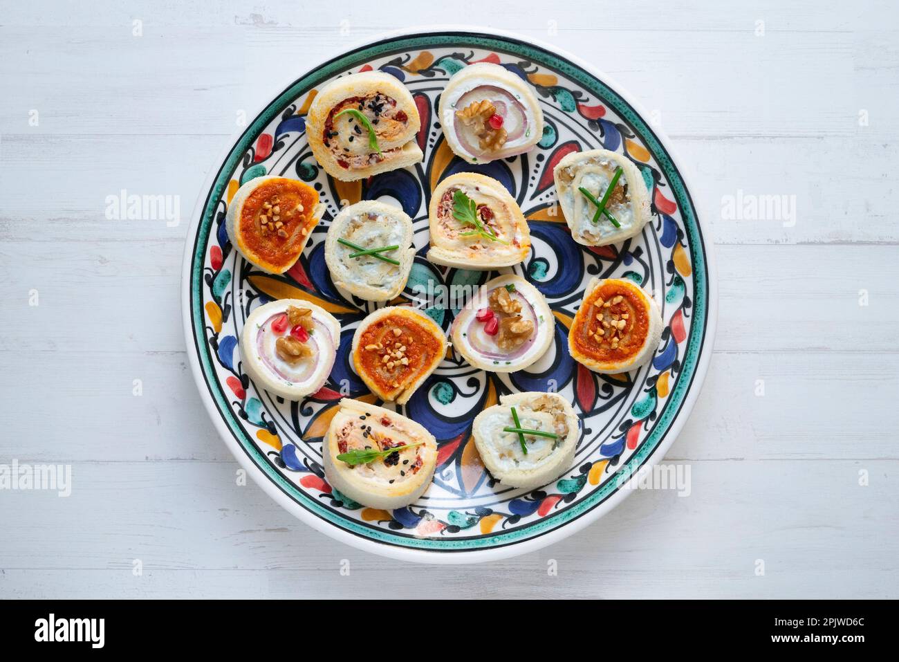 Canapes made with sliced bread stuffed with cheese, nuts, sobrassada ...