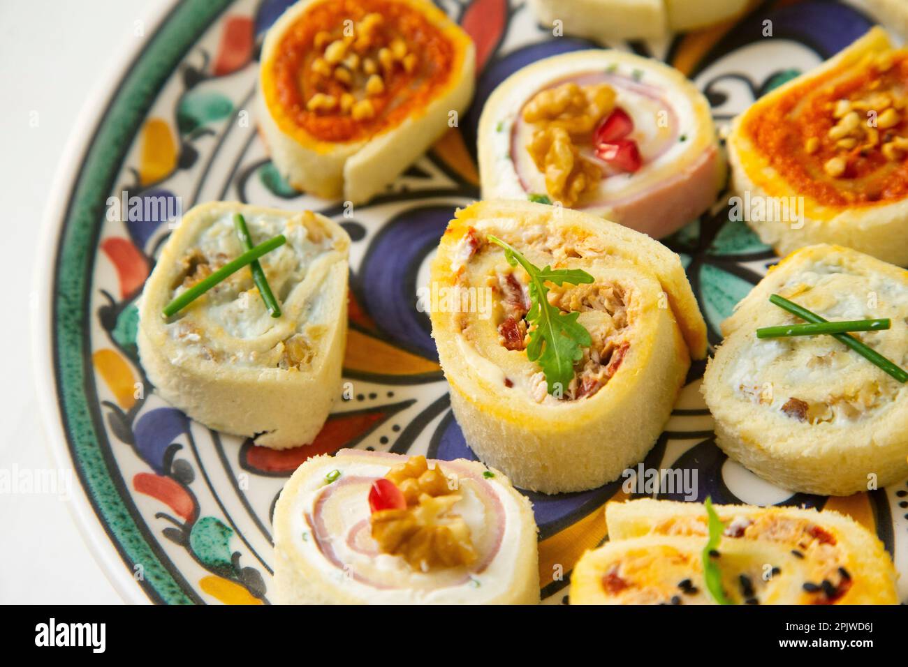 Canapes made with sliced bread stuffed with cheese, nuts, sobrassada ...
