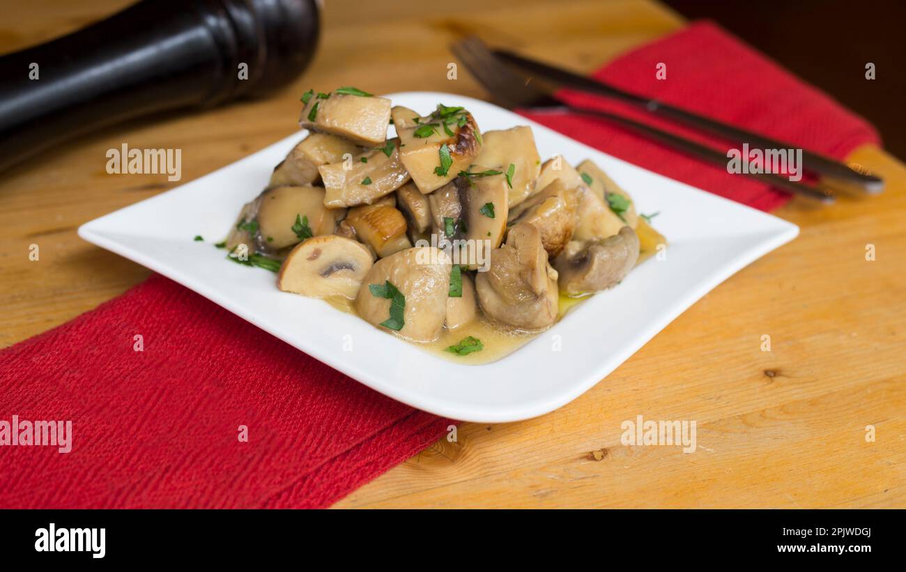 Mushrooms cooked with white wine. Traditional Spanish tapa Stock Photo ...