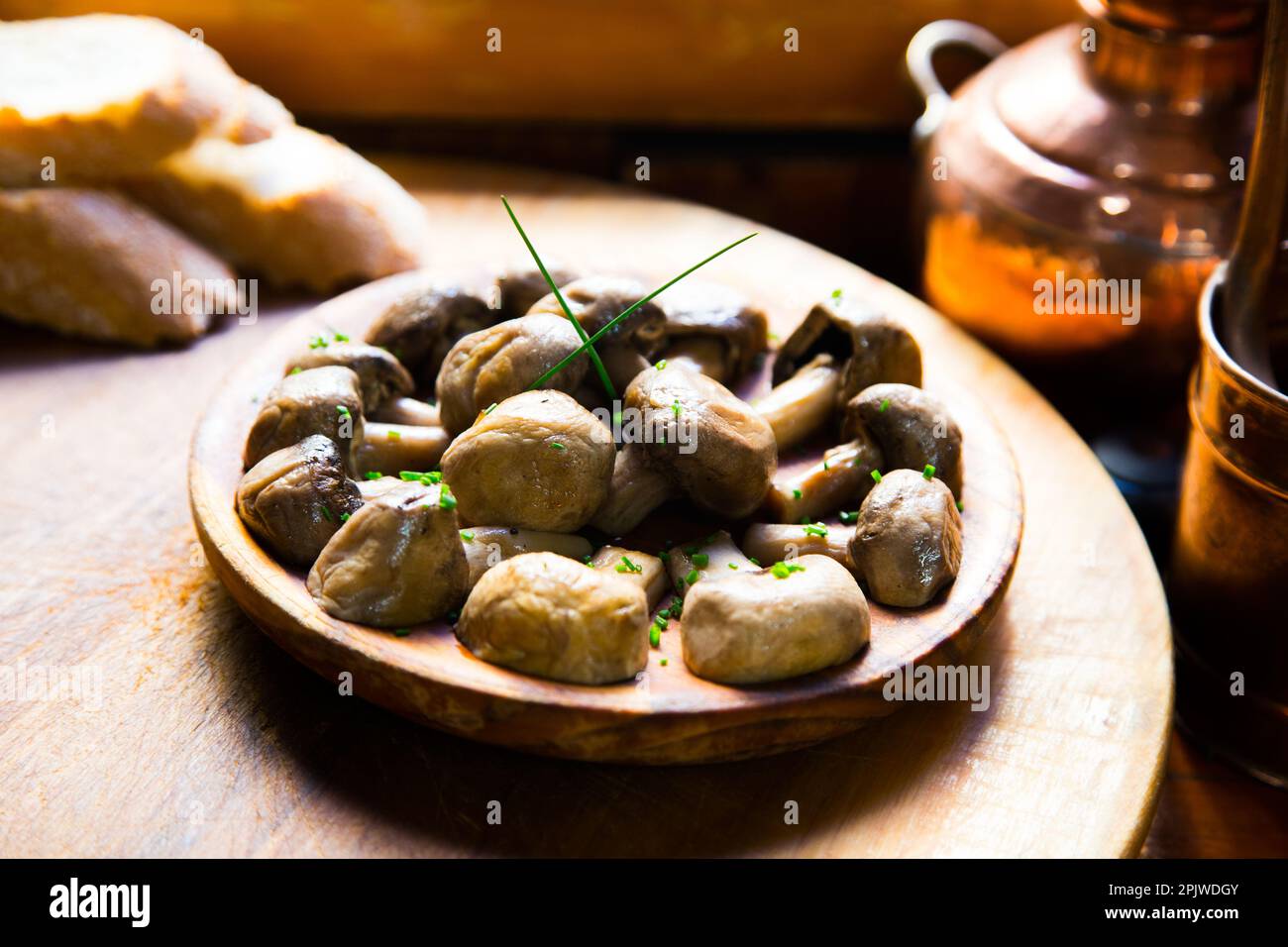 Mushrooms cooked with white wine. Traditional Spanish tapa Stock Photo ...