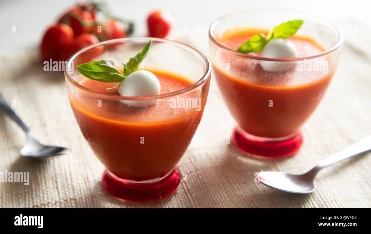 Tomato flan made with gelatin and a small ball of mozzarella Stock ...