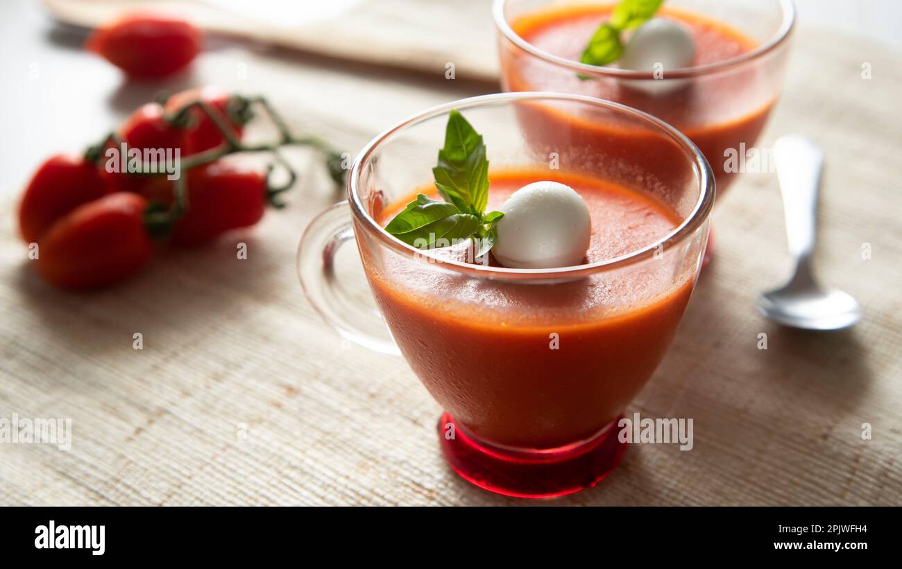 Tomato flan made with gelatin and a small ball of mozzarella Stock ...