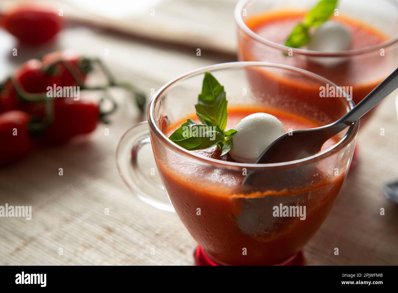 Tomato flan made with gelatin and a small ball of mozzarella Stock ...