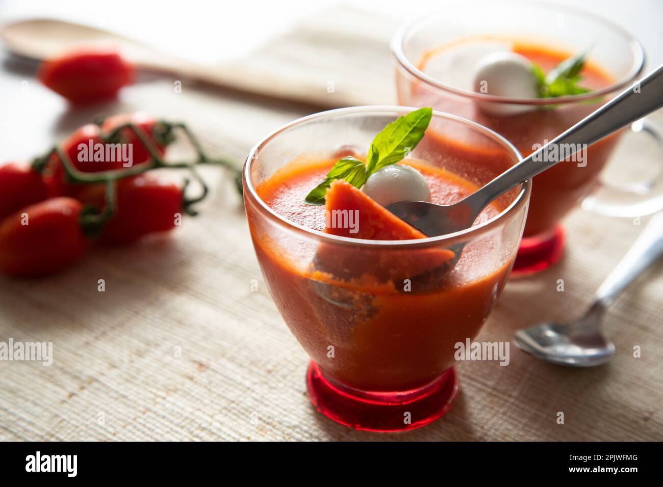 Tomato flan made with gelatin and a small ball of mozzarella Stock ...