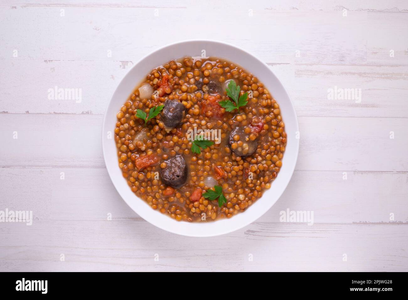 Lentil dish with potato, chorizo and black pudding. Traditional Spanish ...