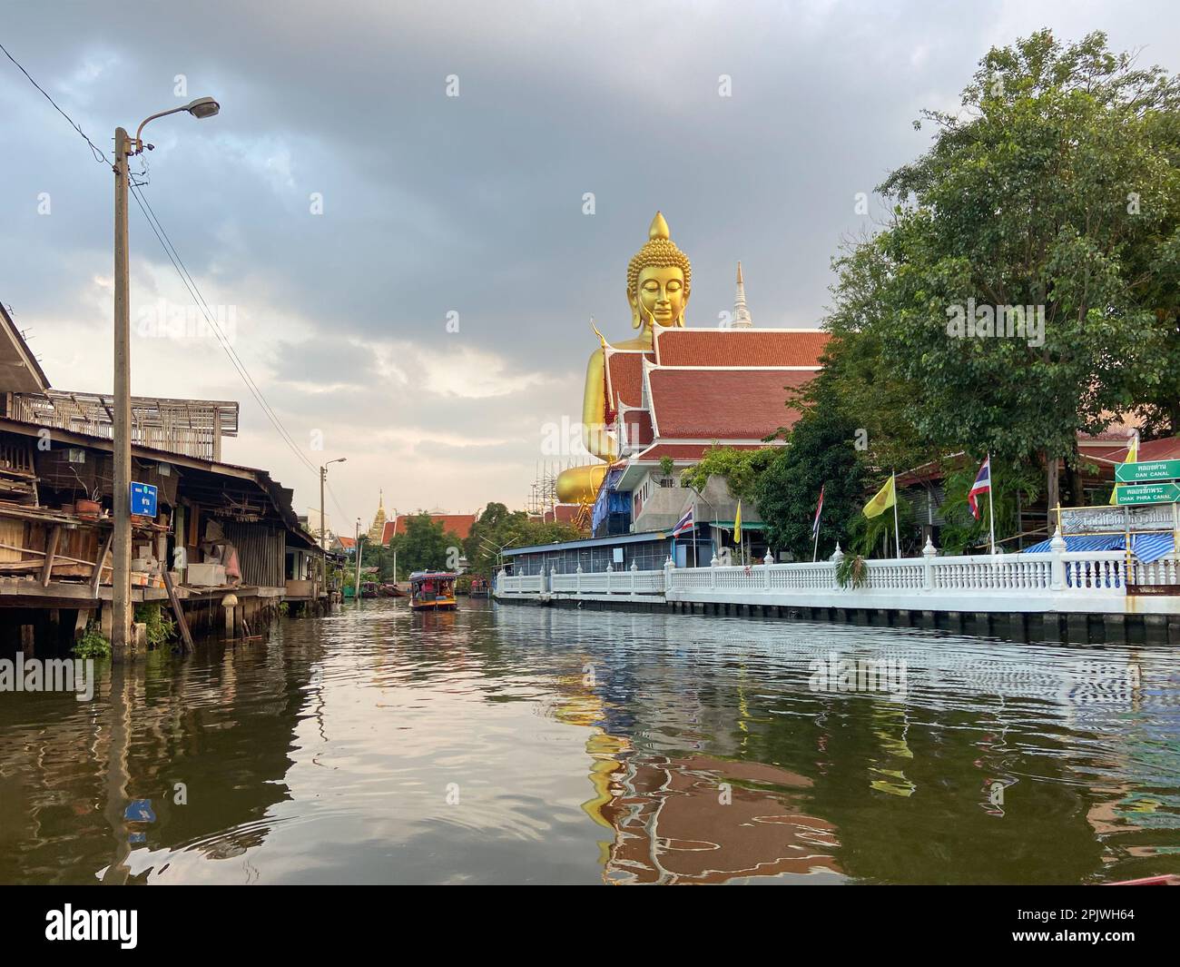 Chao Phraya River and canals of Bangkok by boat and big golden Buddha ...