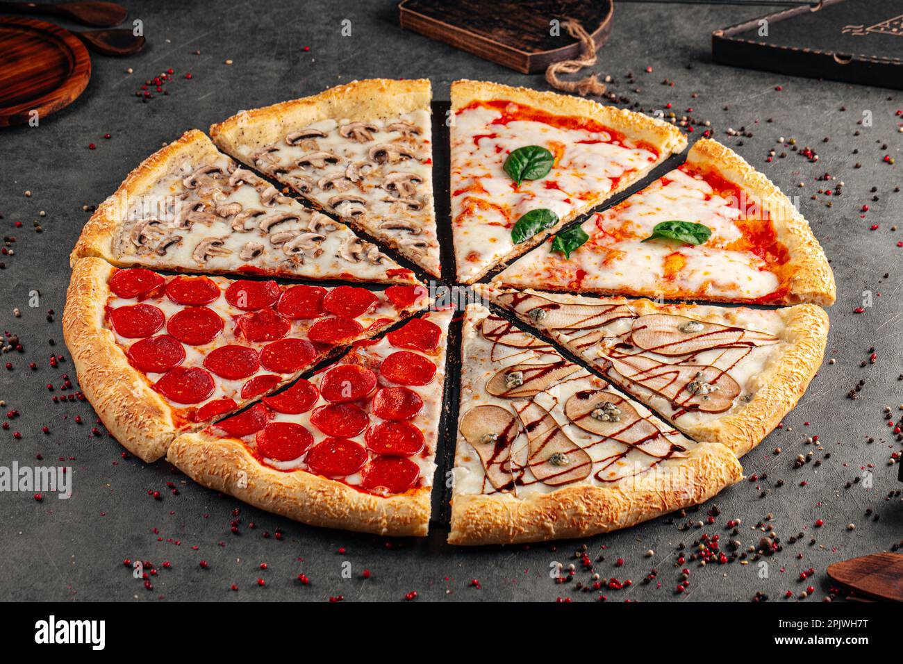 Big assorted pizza with variety of toppings Stock Photo - Alamy