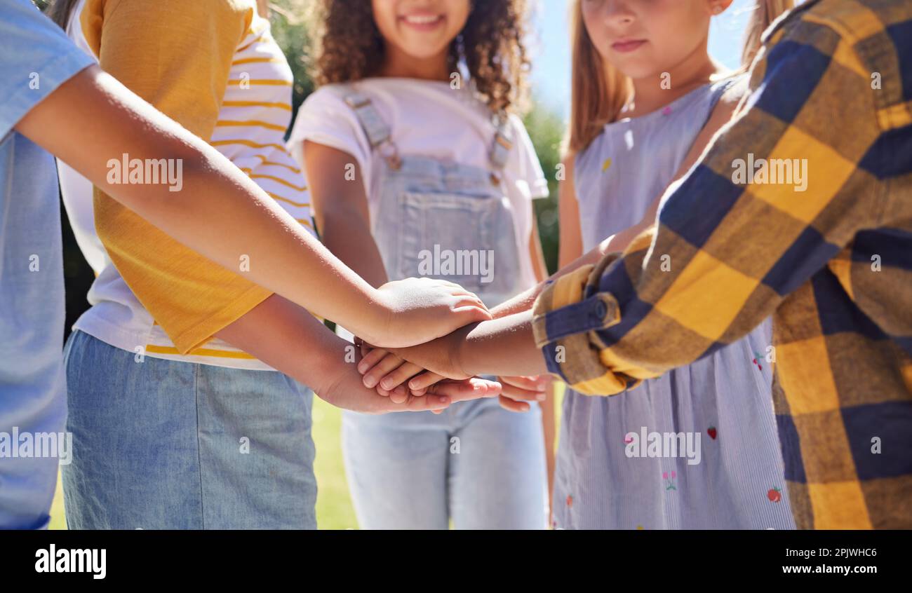 Hands together, support and children outdoor, solidarity and trust with ...