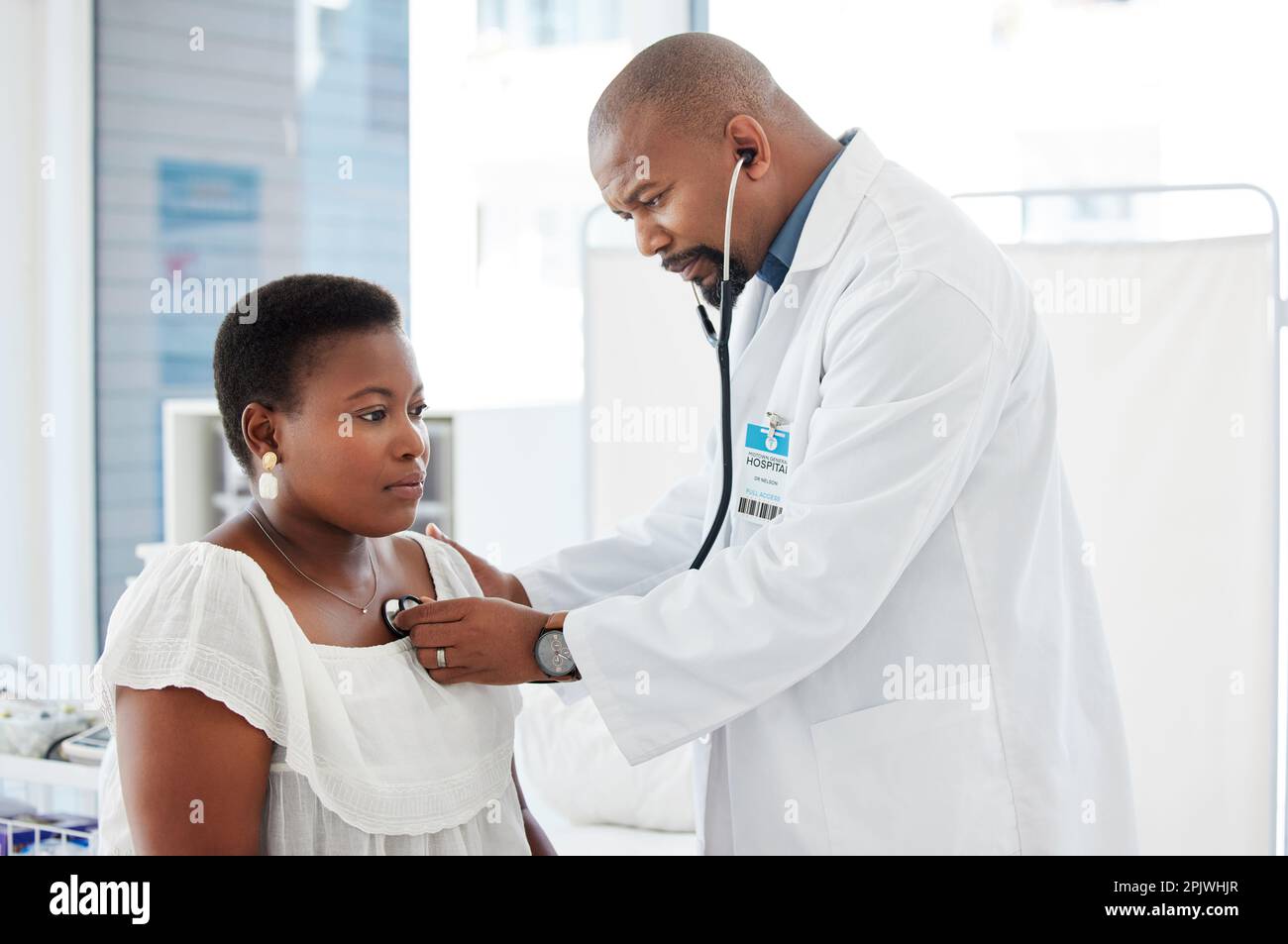 Healthcare, doctor listening to patient heart with stethoscope and medical consultation with ...