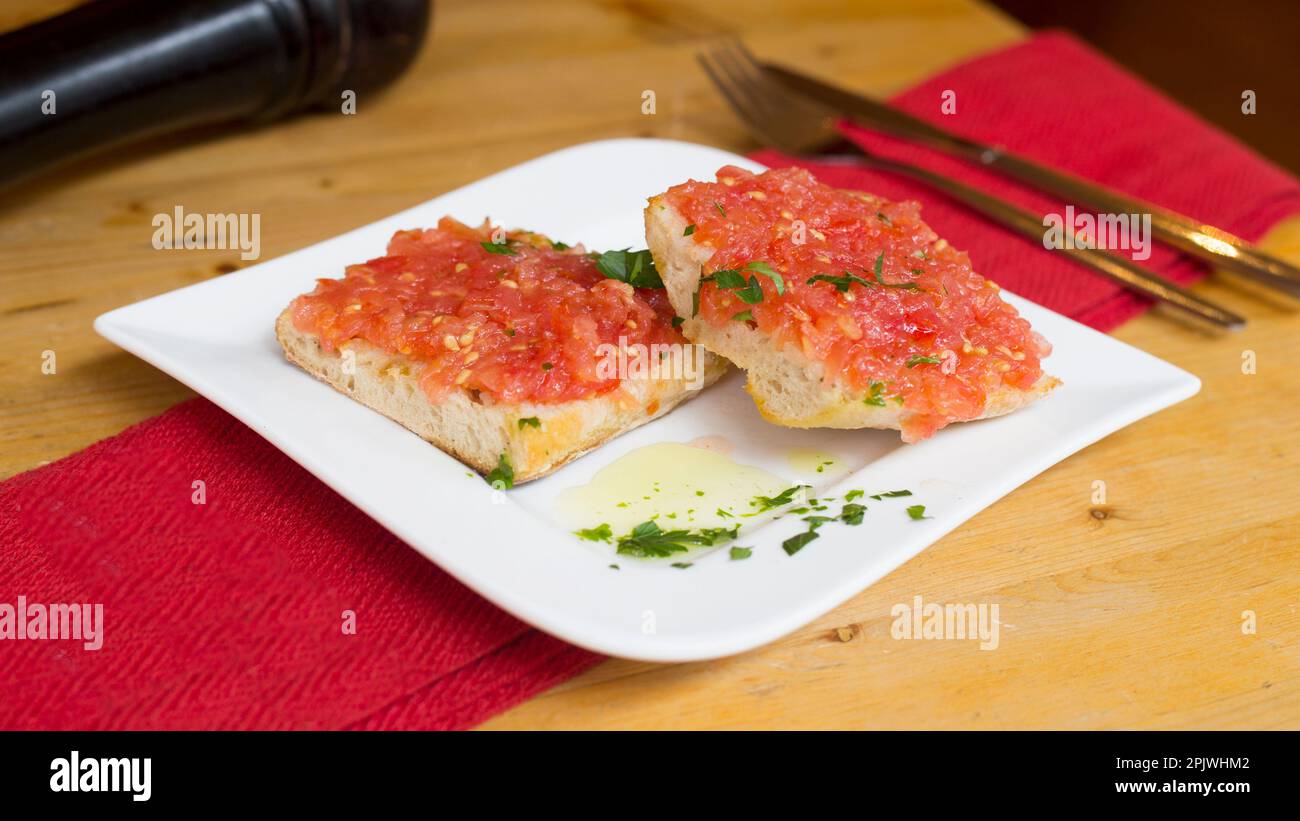Toasted bread with tomato and oil. Traditional Spanish tapa Stock Photo ...