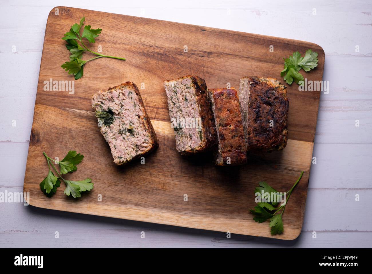 Baked meat and spinach pie Stock Photo - Alamy