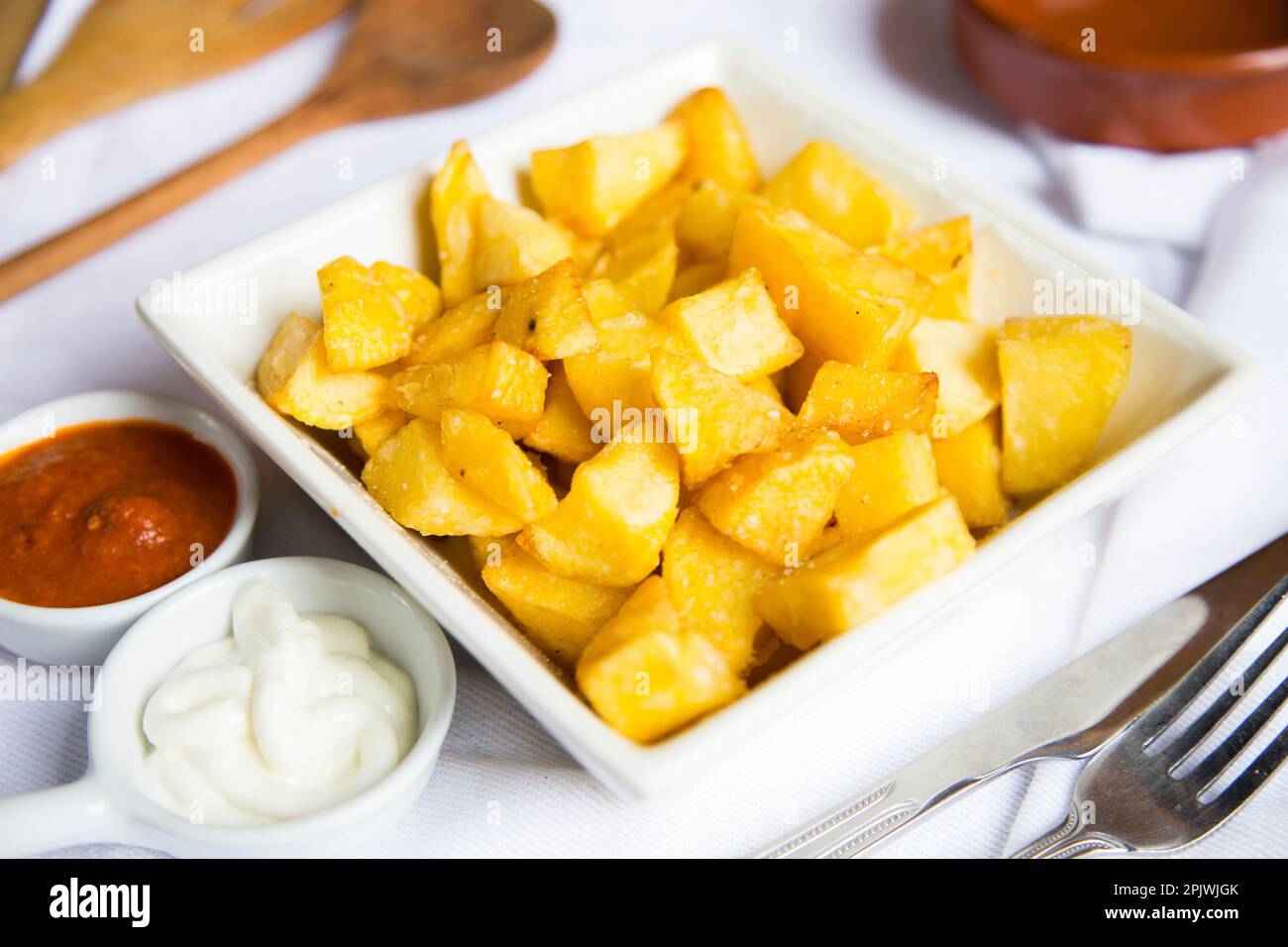 Papas bravas, are a typical preparation of bars in Spain consisting of ...
