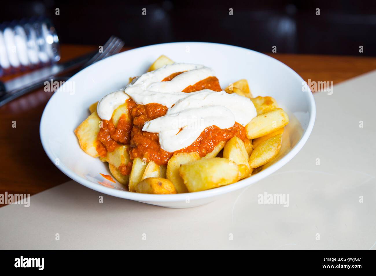Papas bravas, are a typical preparation of bars in Spain consisting of ...