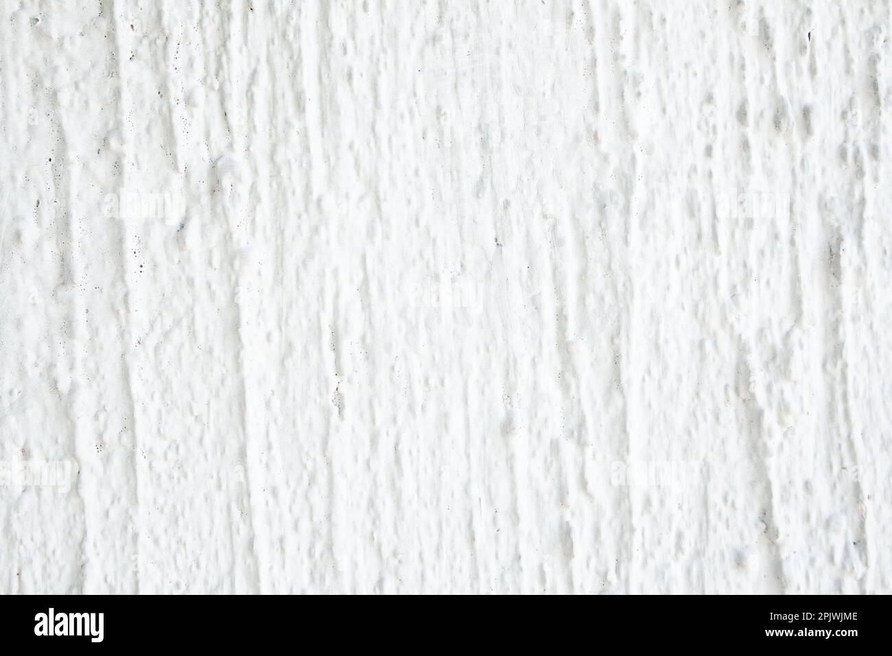 Background light grey, embossed plaster with stripes and scratches ...