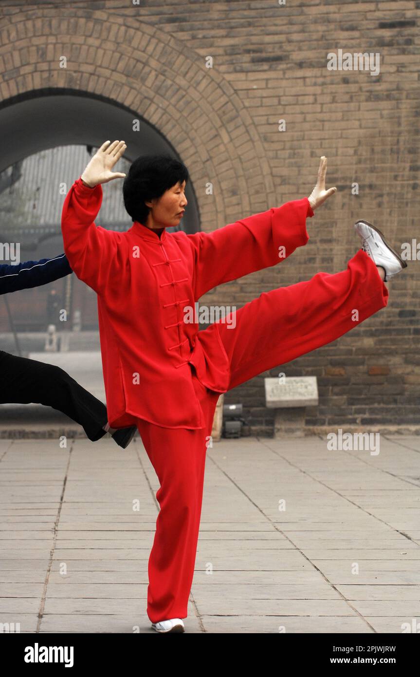 Tai chi chuan exercises in the morning at Little Goose Pagoda park ...