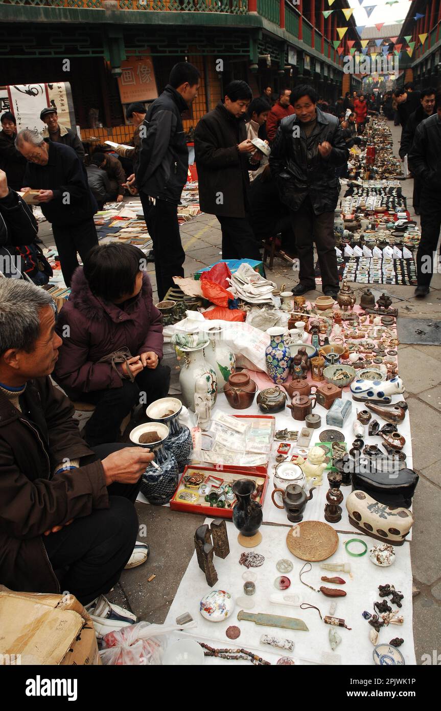 Memorabilia of Mao Tse Tung and the revolution on sale at the market as ...