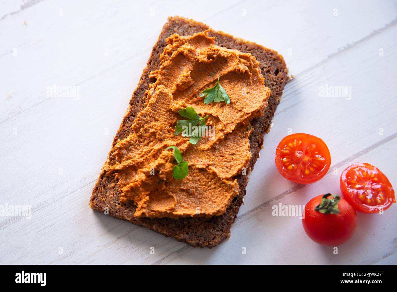 Toast with vegetarian pate made with dried tomato and other vegetables ...