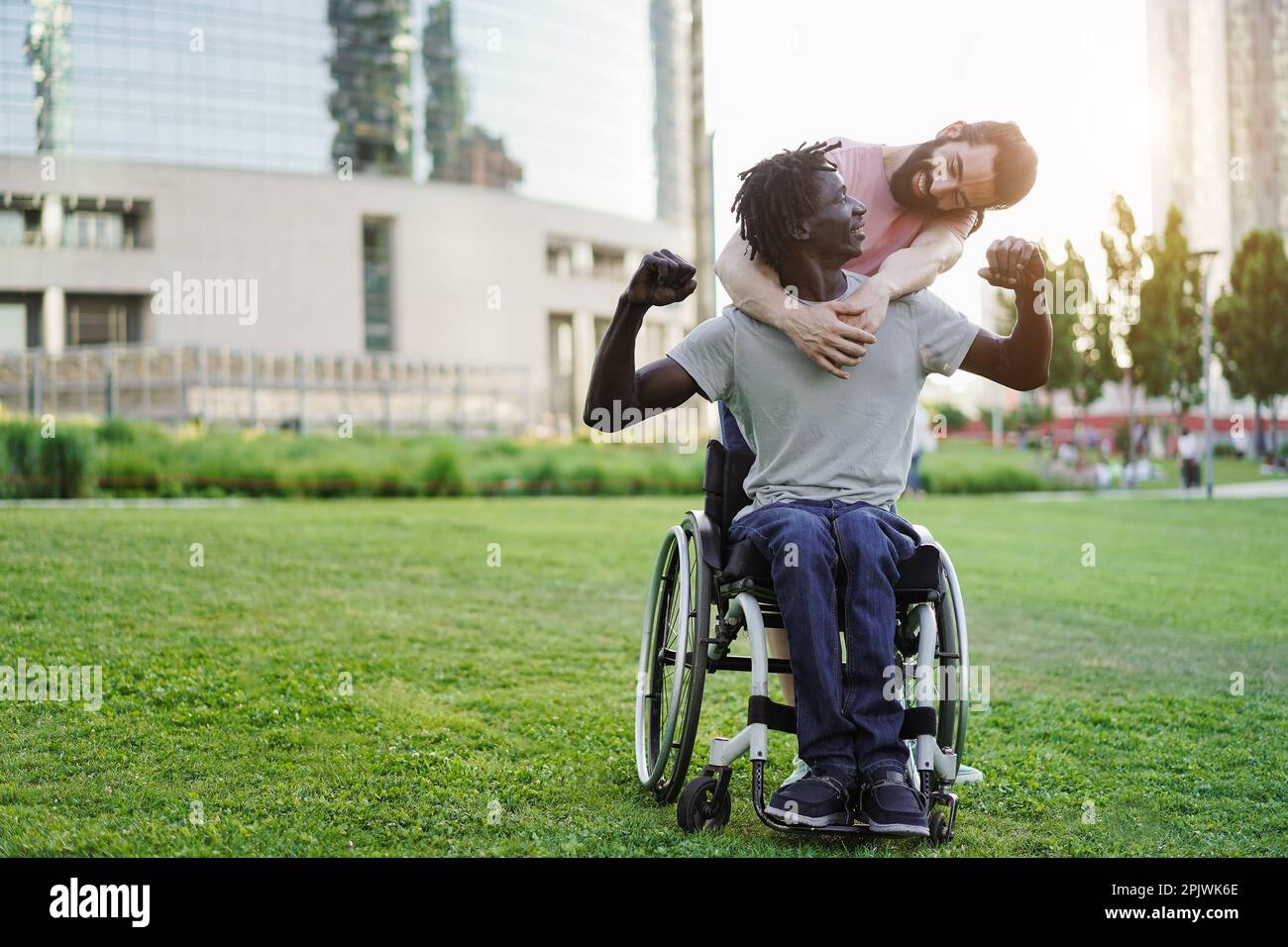 Happy friends with disability having fun at park city - Focus on ...