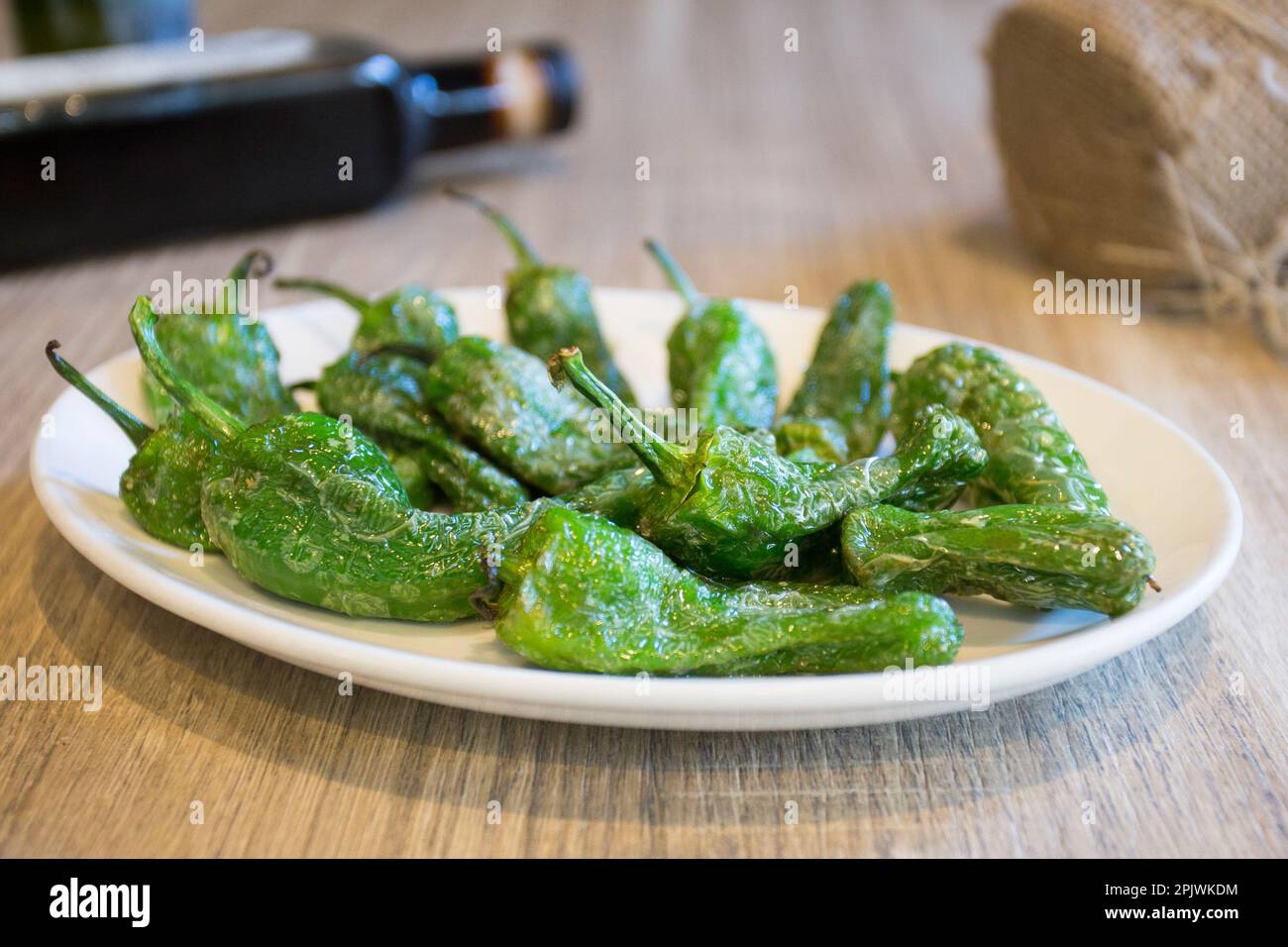 Fried green padron peppers. Traditional Spanish tapa Stock Photo - Alamy