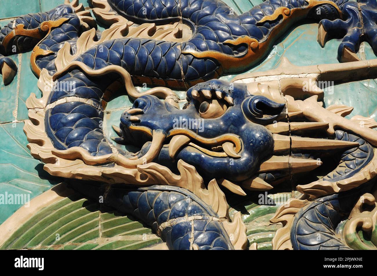 The Nine Dragon Wall at Beihai Park covered in tiles. Beijing; China ...