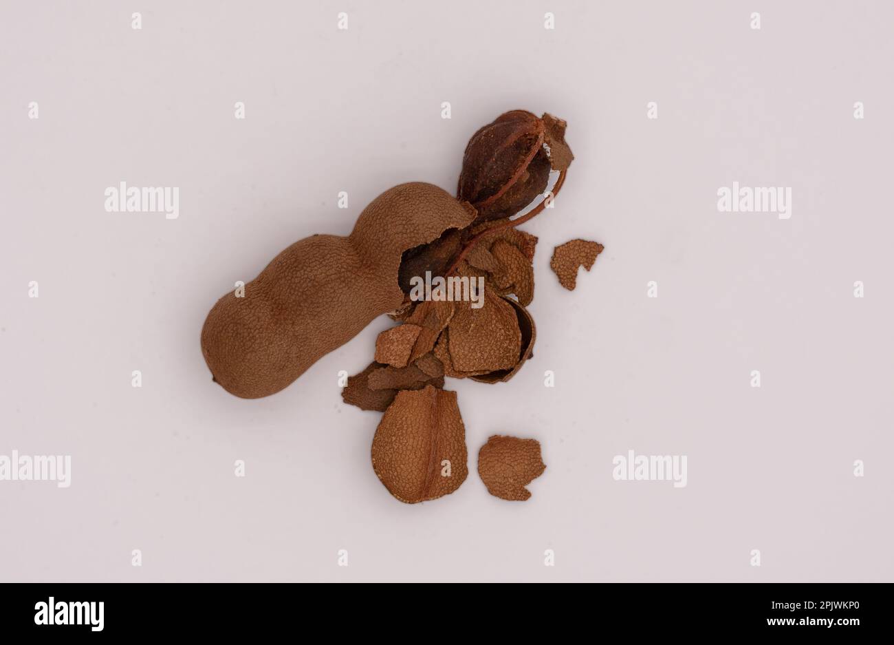 Top of view of peeled tamarind on isolated white background Stock Photo ...