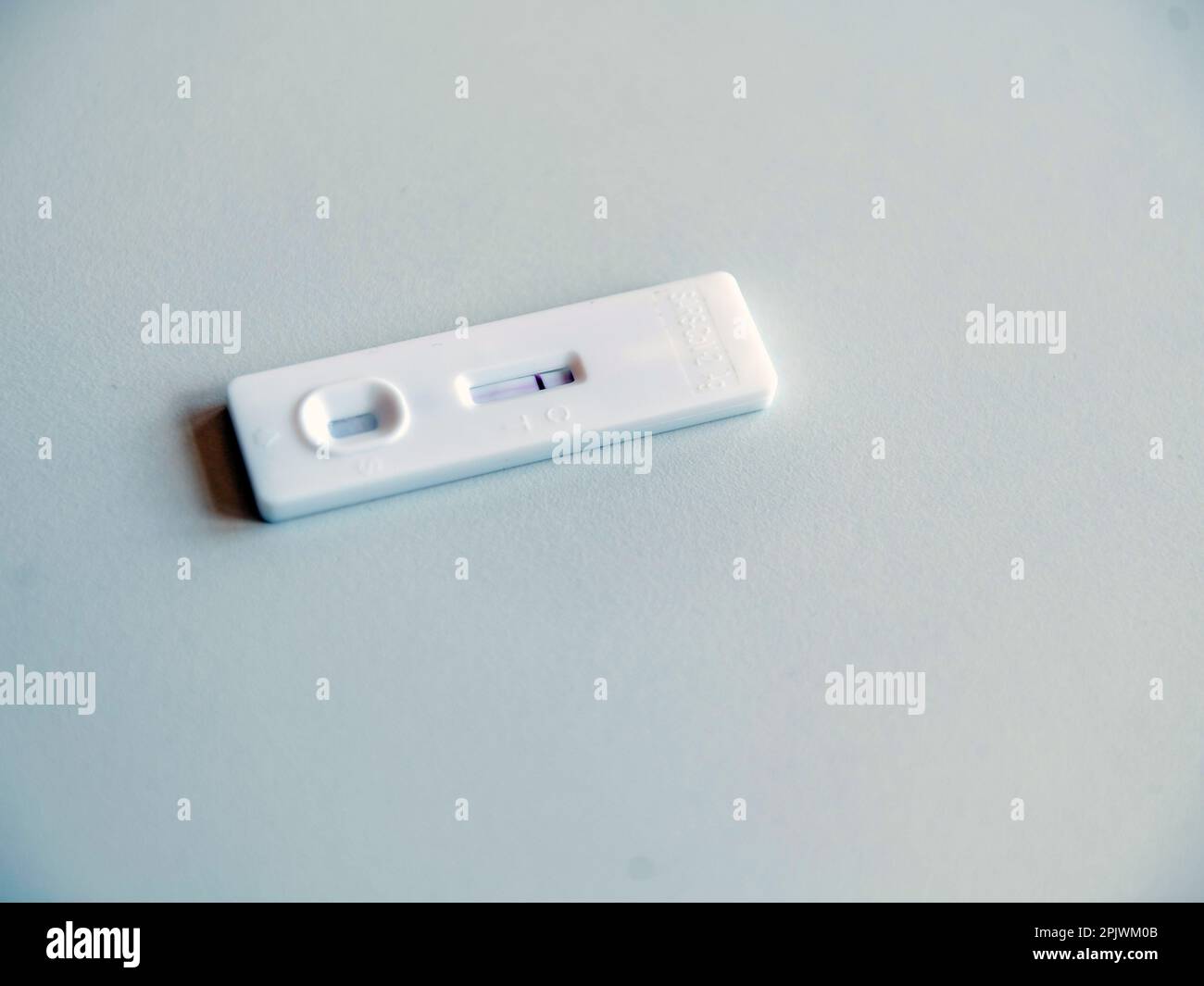Close up of a rapid test for the diagnosis of covid-19 on a white ...