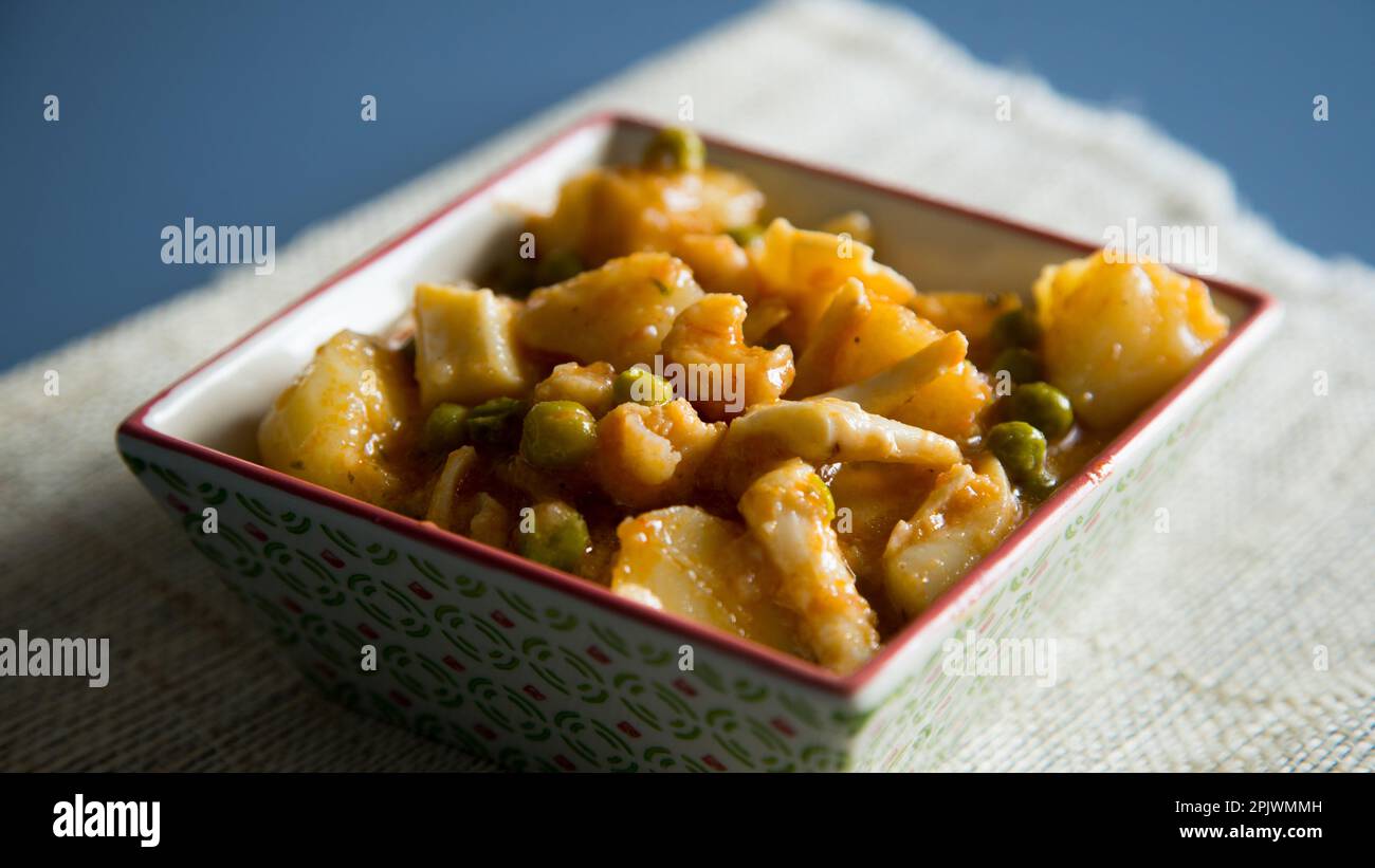 Stewed cuttlefish with potatoes. Traditional Spanish tapa recipe Stock ...