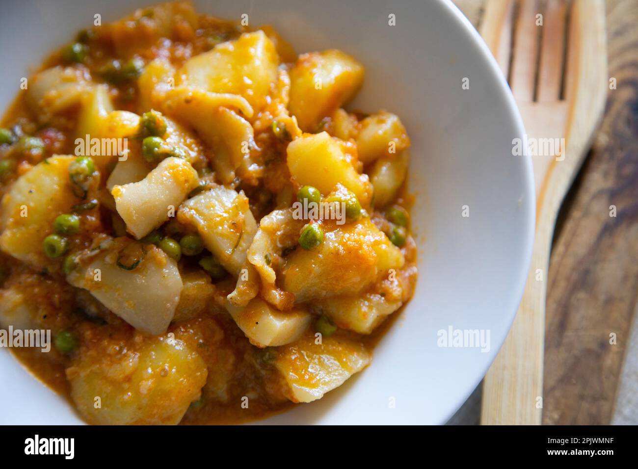 Stewed cuttlefish with potatoes. Traditional Spanish tapa recipe Stock ...