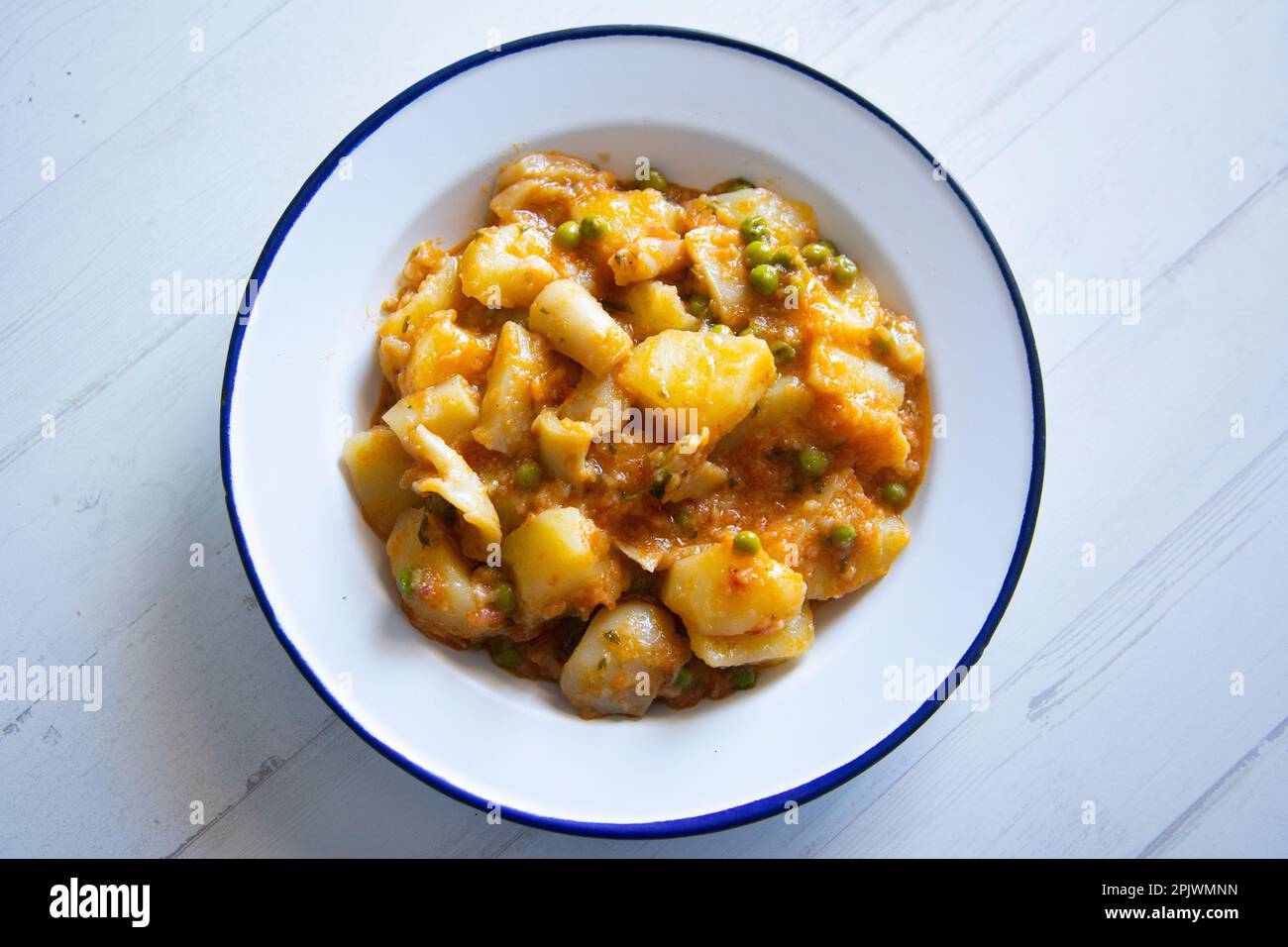 Stewed cuttlefish with potatoes. Traditional Spanish tapa recipe Stock ...