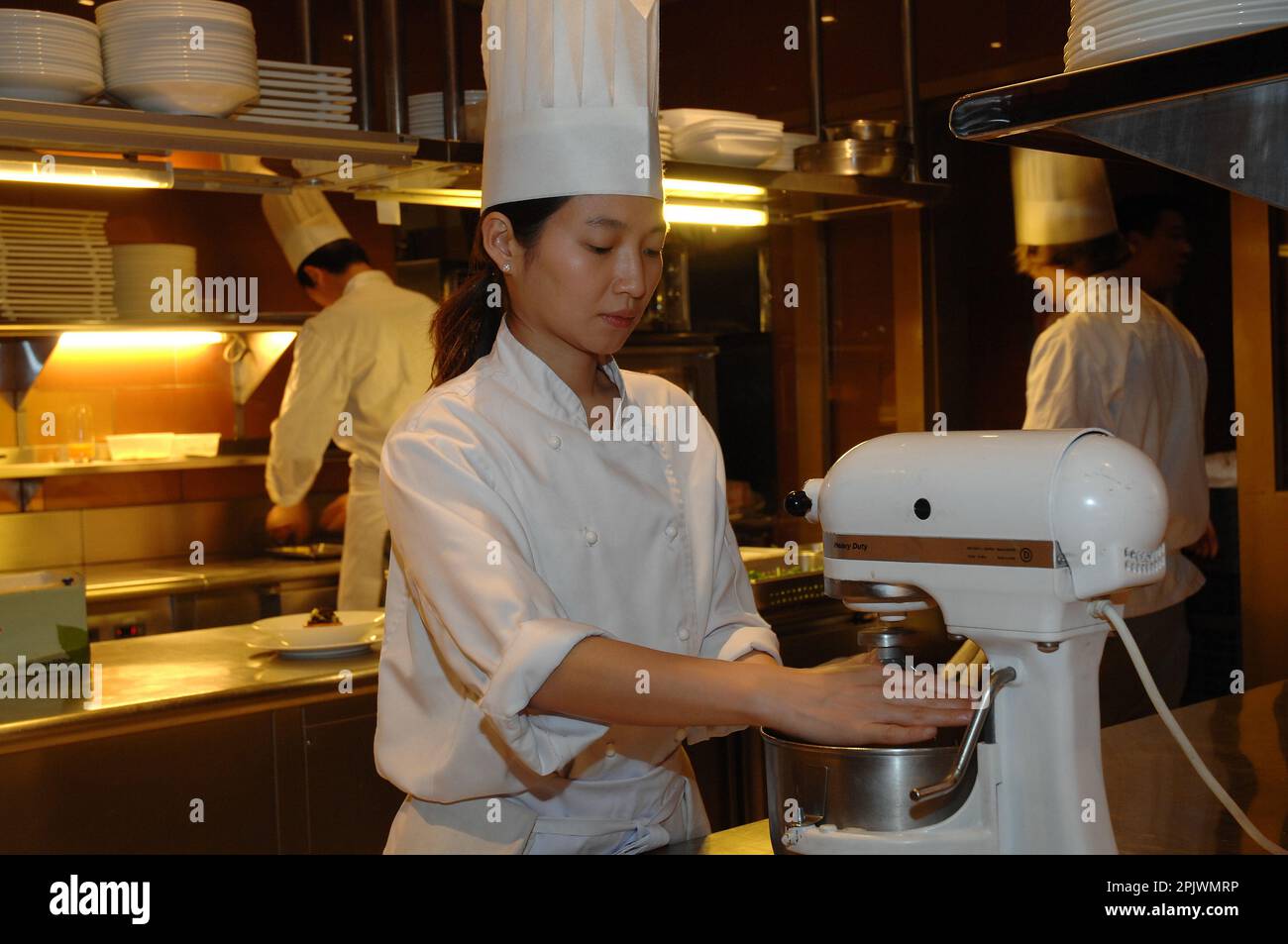 Young cook at work with a Kitchen Aid mixer. Shanghai, China, Asia ...