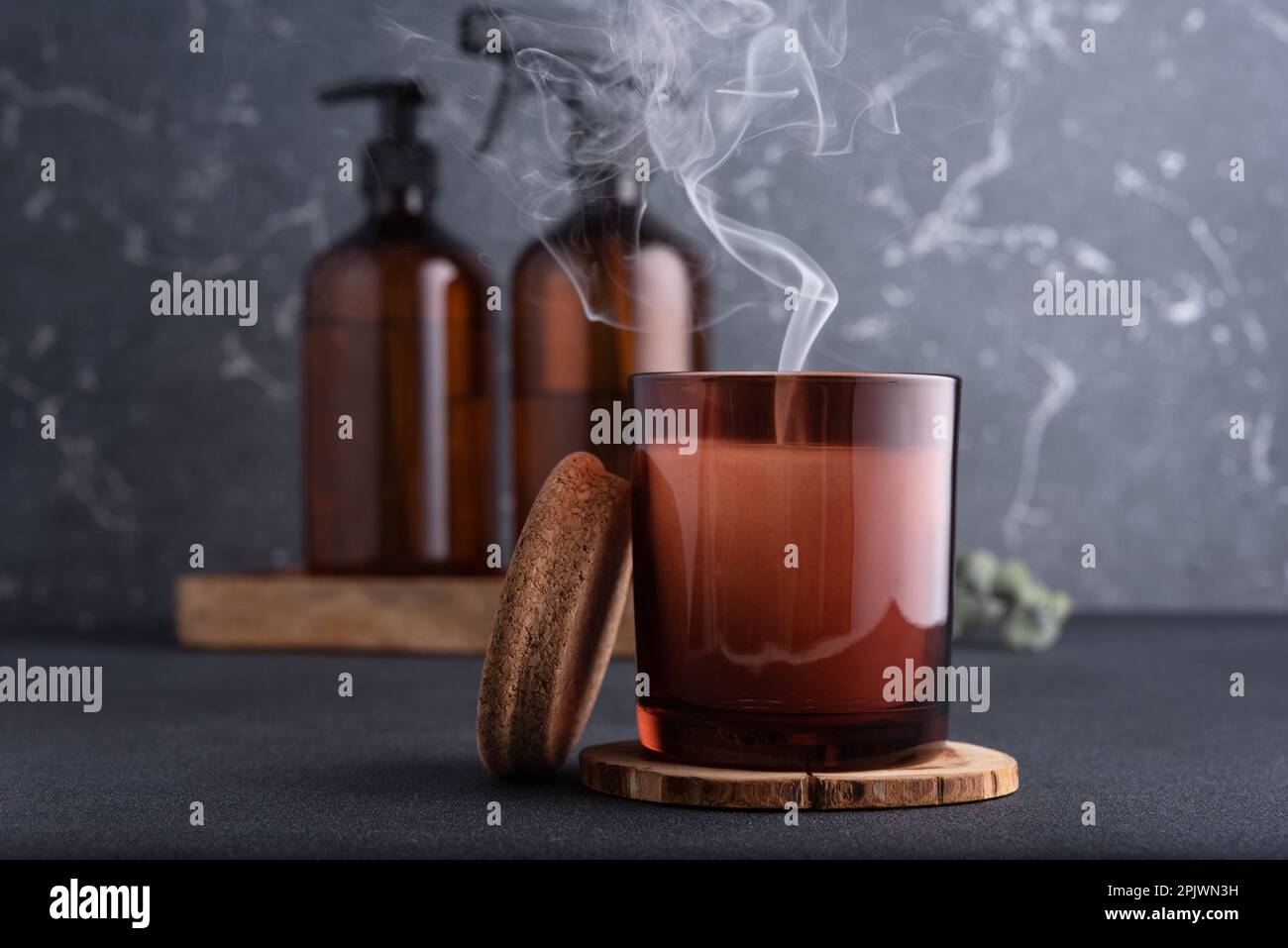 Spa composition with burning candle and recycled dispenser bottles for ...