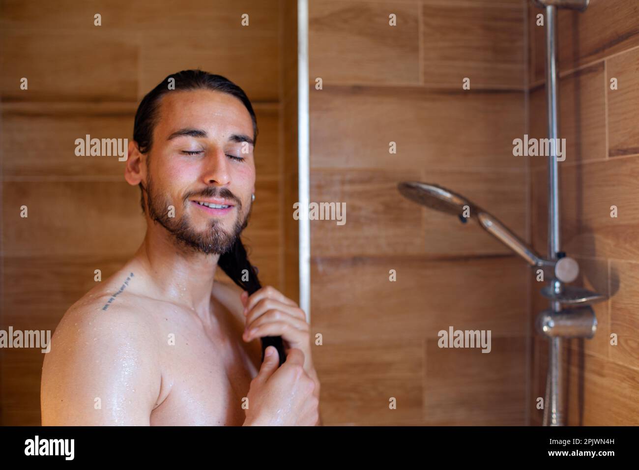 Long hair man showering hi-res stock photography and images - Alamy