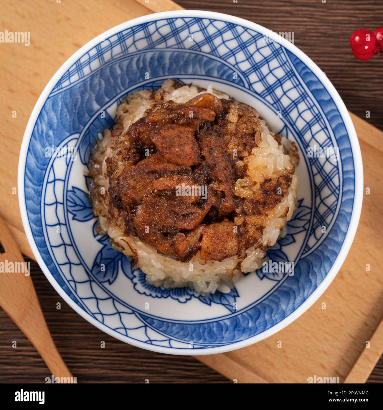 Migao, tube rice cake, rice pudding in a bowl topped with minced pork ...