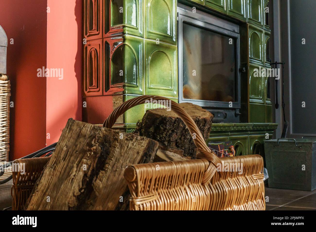 a fireplace and a tiled stove Stock Photo - Alamy