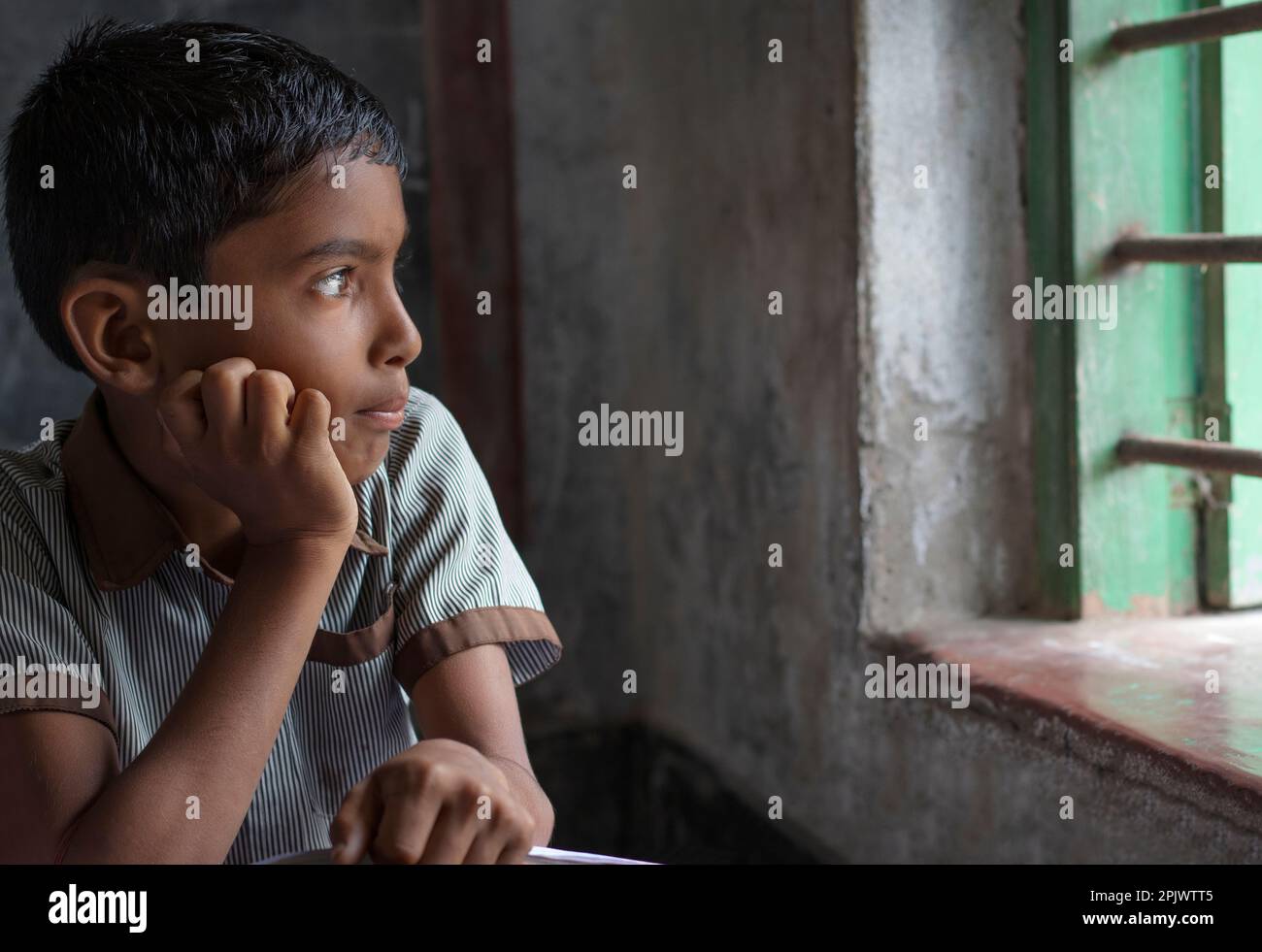 school boy sitting in his class and thinking about something Stock ...