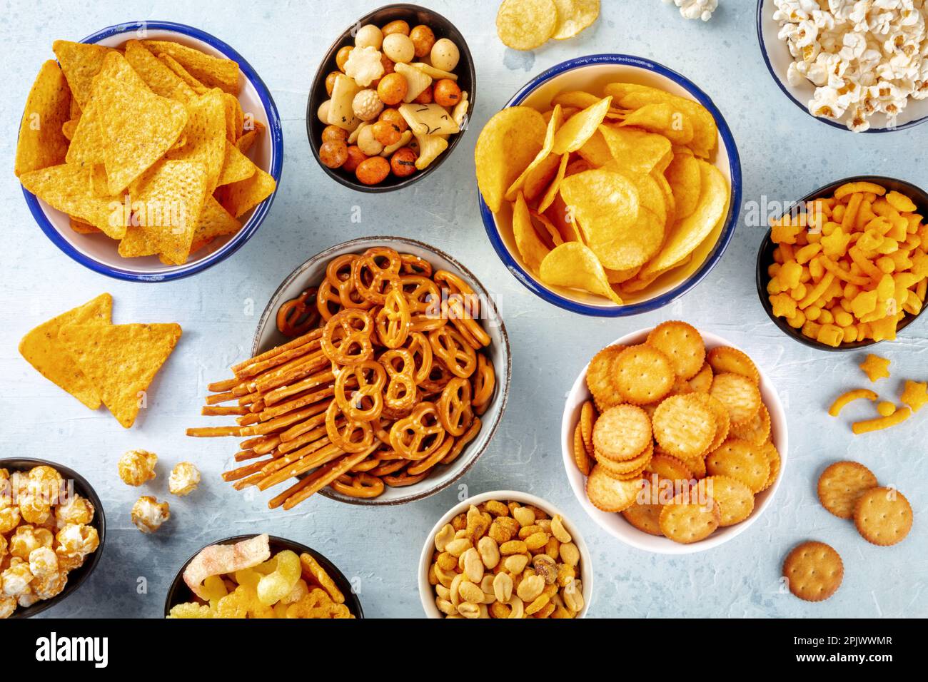 Salty snacks, party mix. An assortment of crispy appetizers, overhead ...