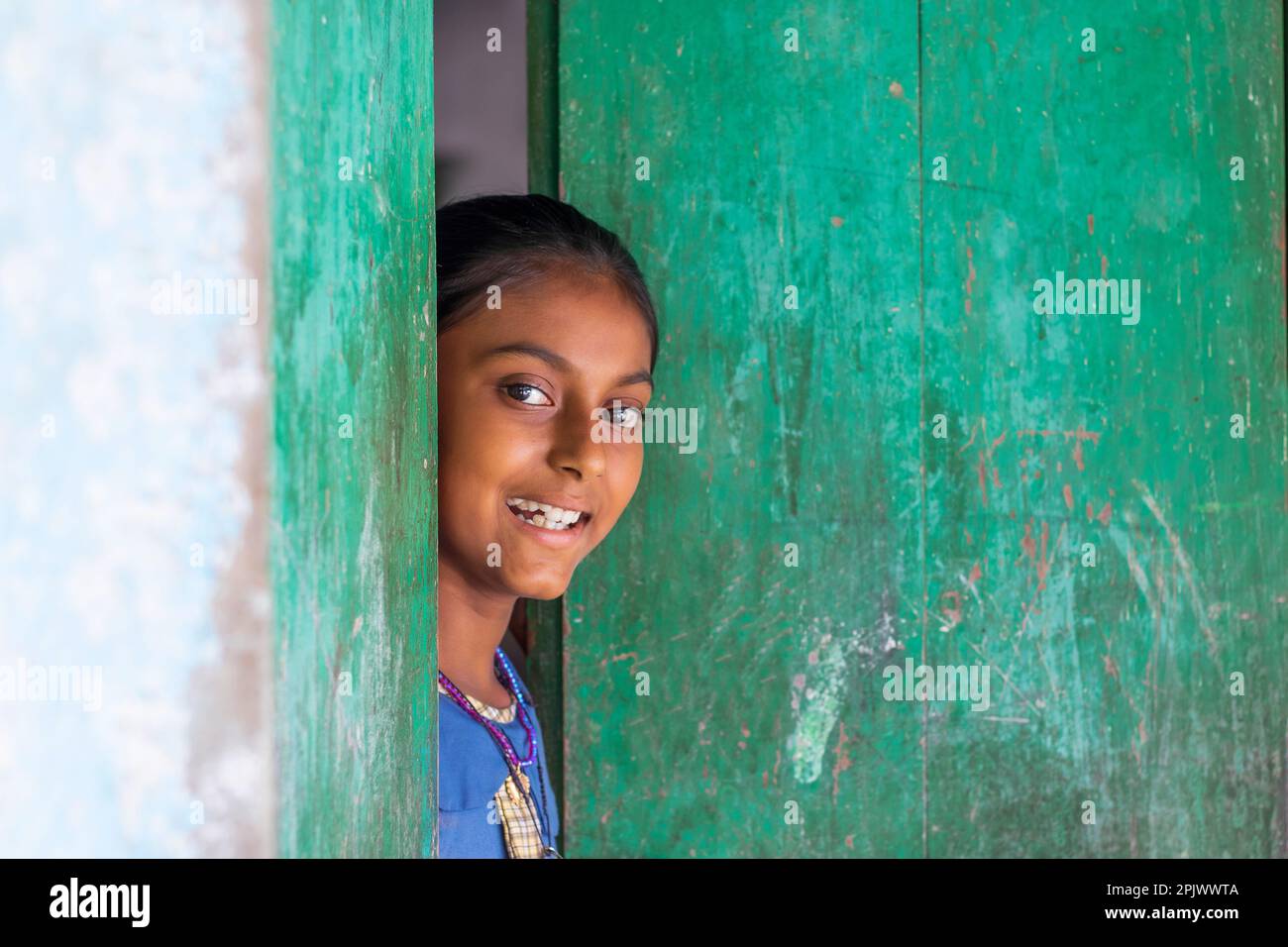School girl peeping from a classroom Stock Photo - Alamy